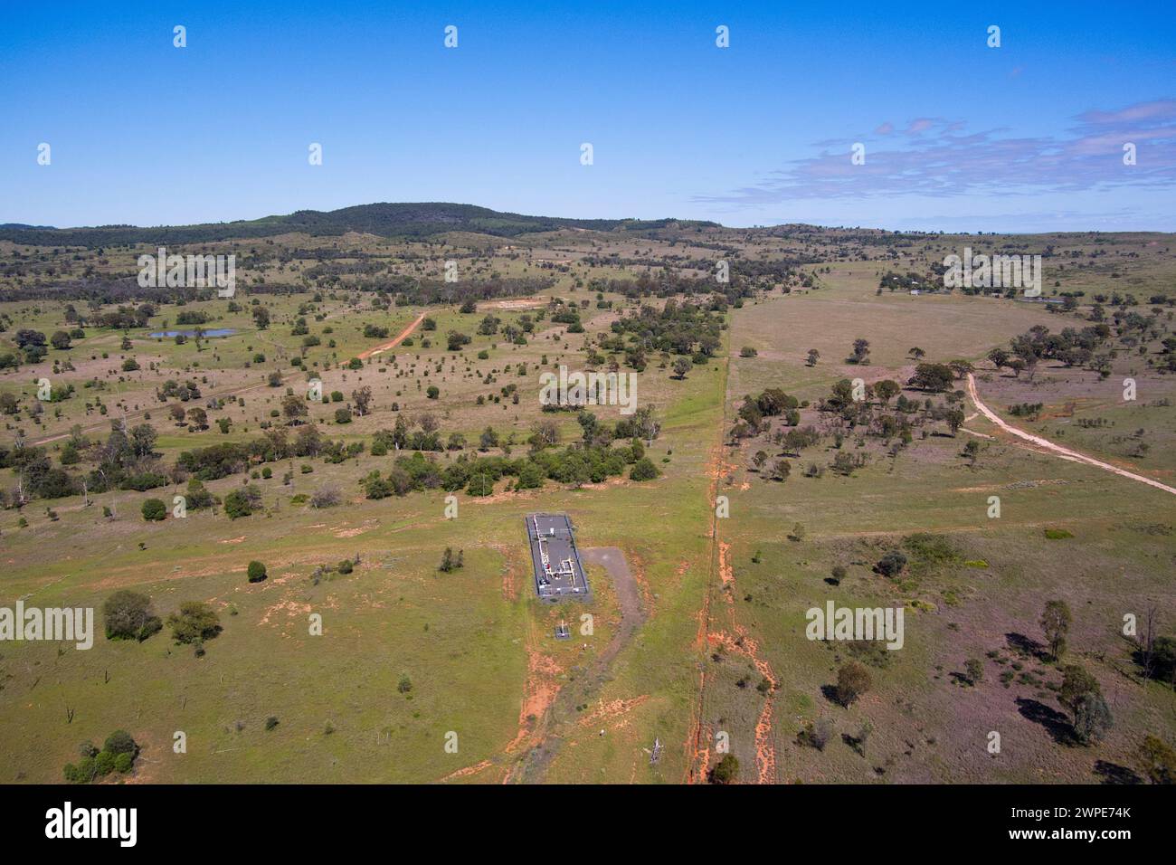 Aerial of the coal seam gas (CSG) well pumping station on pastoral farm ...