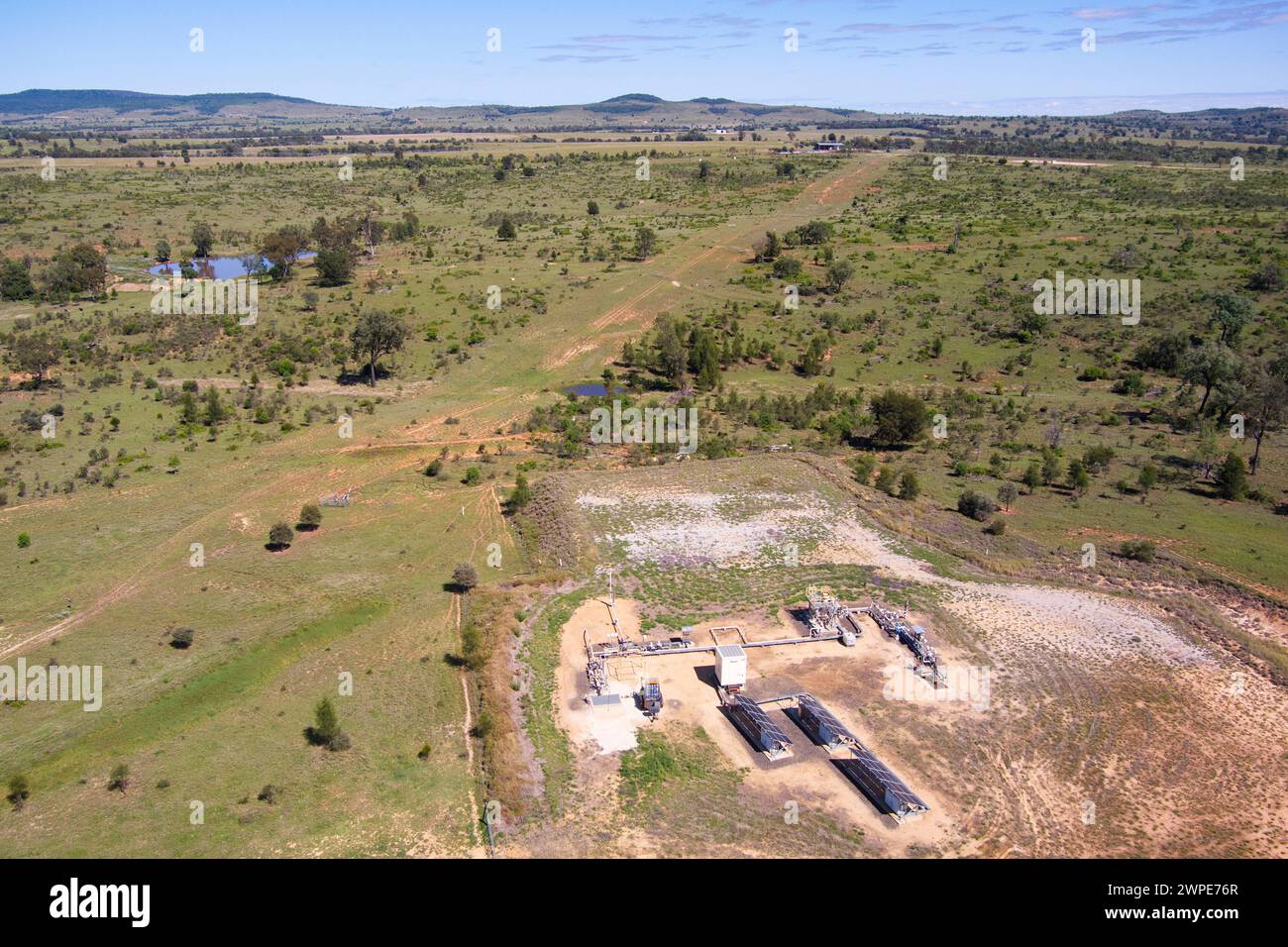 Aerial of coal seam gas (CSG) pumping well owned by Santos using solar ...