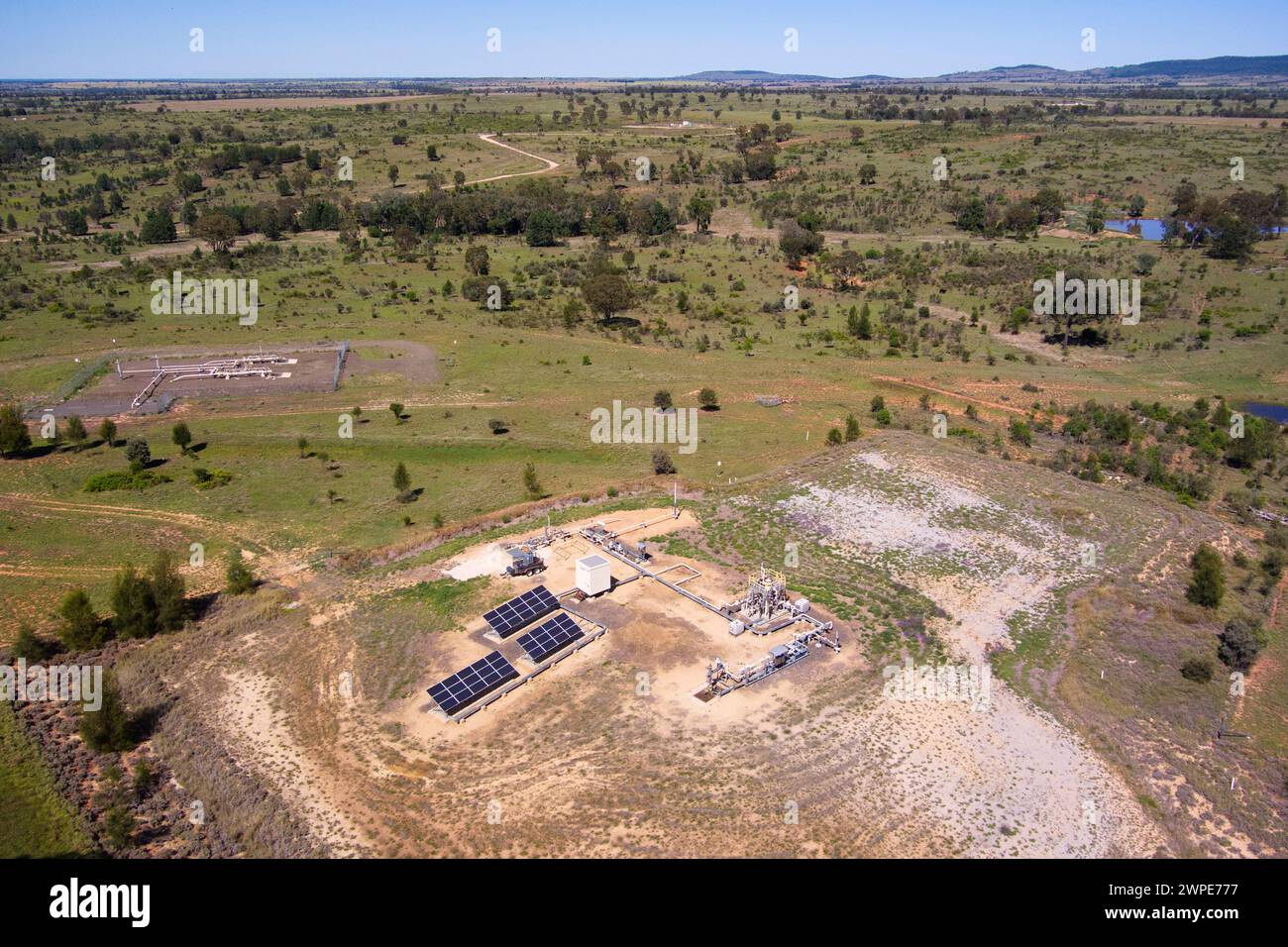 Aerial of coal seam gas (CSG) pumping well owned by Santos using solar ...