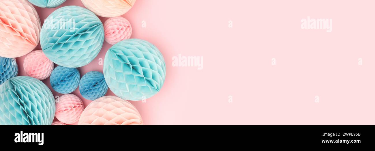 Banner with tissue paper balls different sizes in a blue and pink ...
