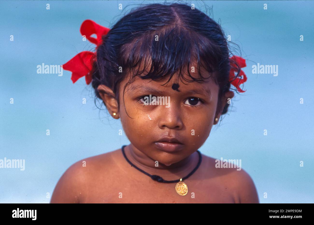 Sri Lanka, Polonaruwa; portrait of a young girl with a bindi on her ...