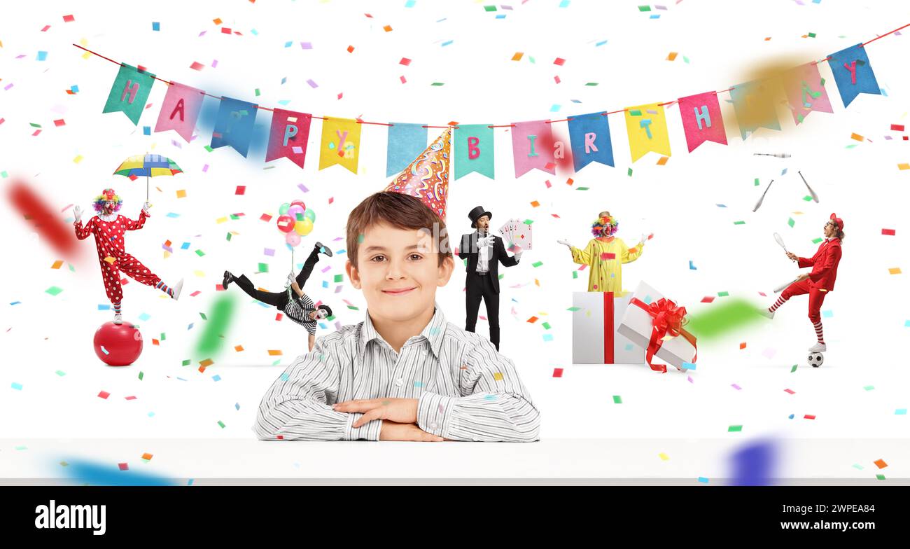 Birthday boy with a party hat celebrating with clowns and entertainers ...