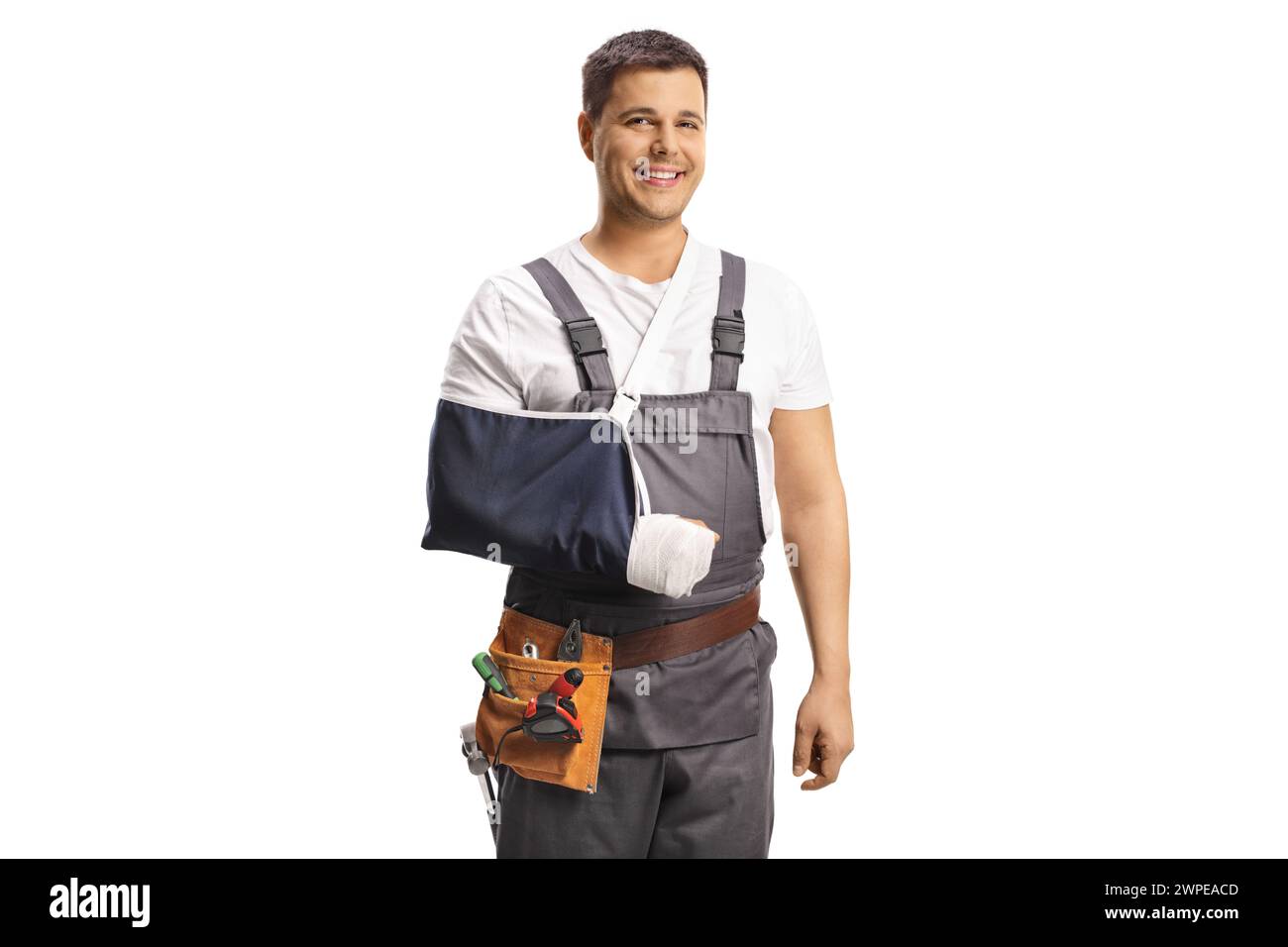 Repairman in a uniform with a broken arm isolated on white background ...