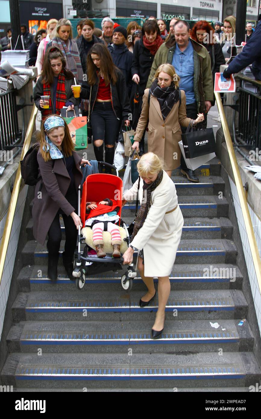 Random acts of kindness. In this image a commuter crowd is held up ...
