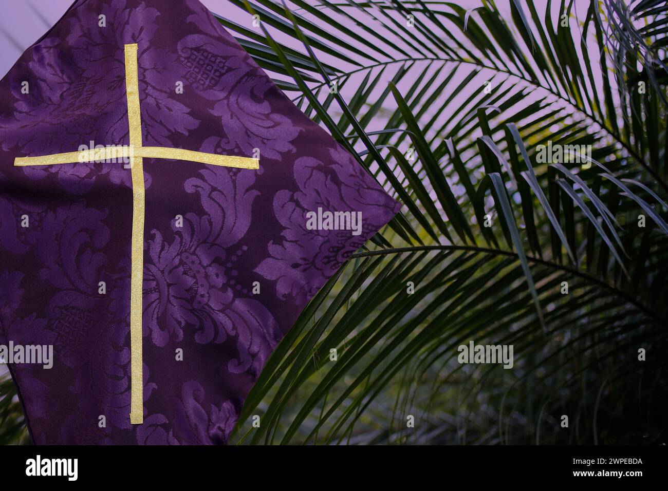 Lent and Holy Week - sacred image covered with purple fabric and symbol ...