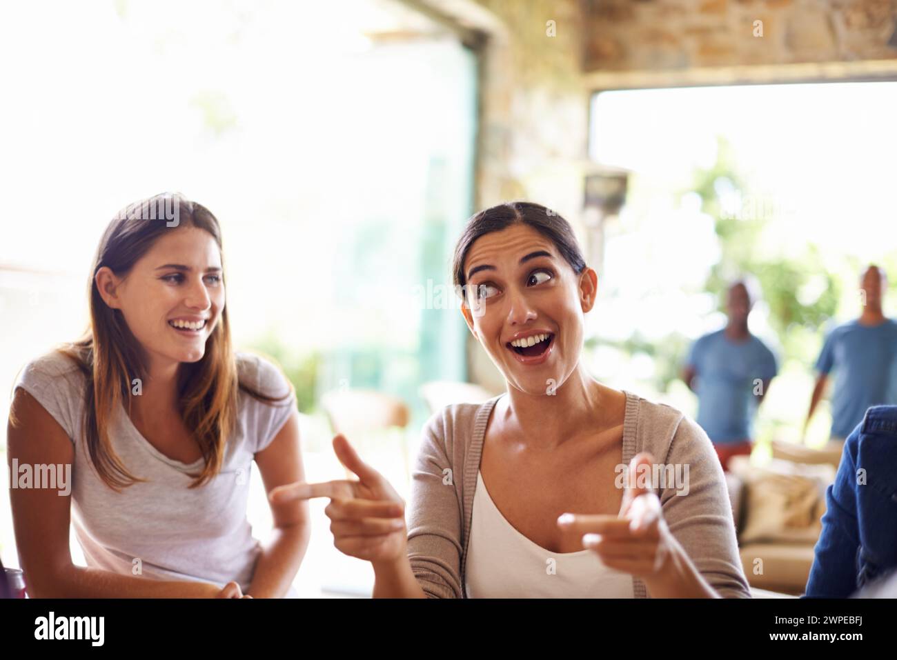 Smile, funny face and conversation with friends in restaurant together ...