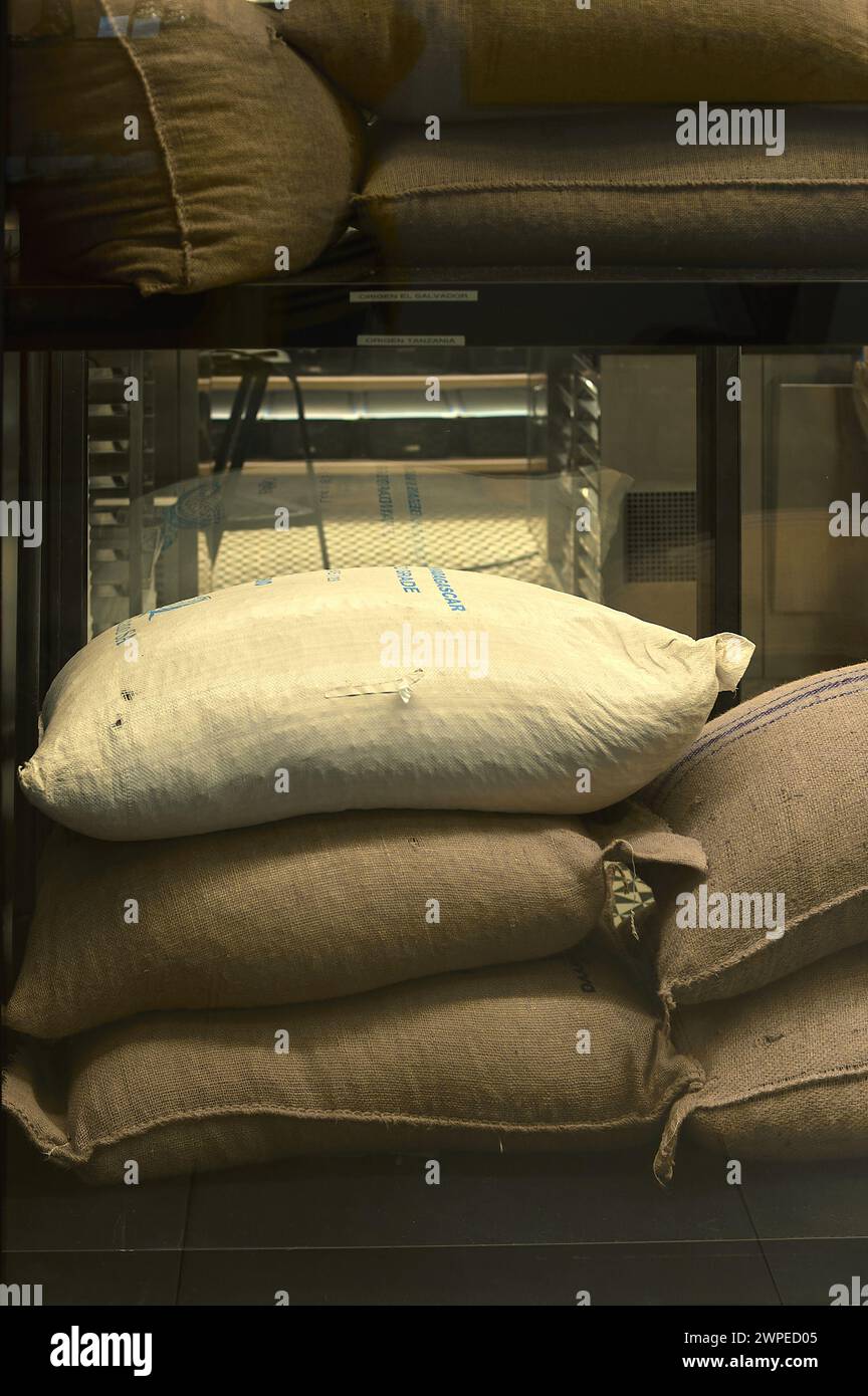 Stacked sacks, some jute and one white, in a dark space Stock Photo - Alamy