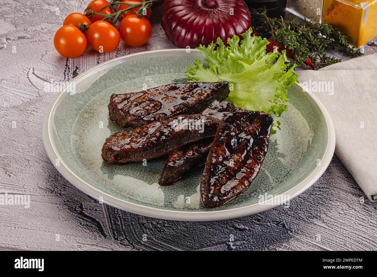 Grilled diet beef liver steak in the plate Stock Photo - Alamy