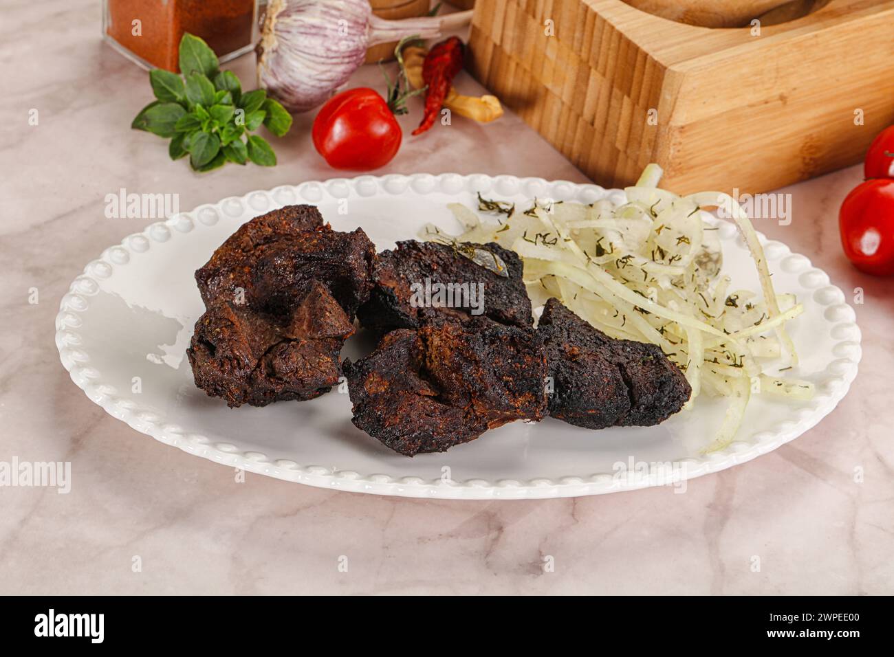 Grilled beef barbecue served onion rings Stock Photo - Alamy