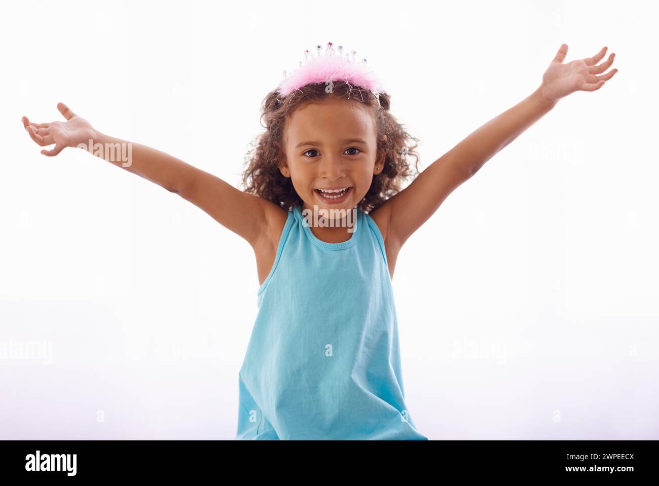 Little girl, excited and portrait on white background, princess crown ...