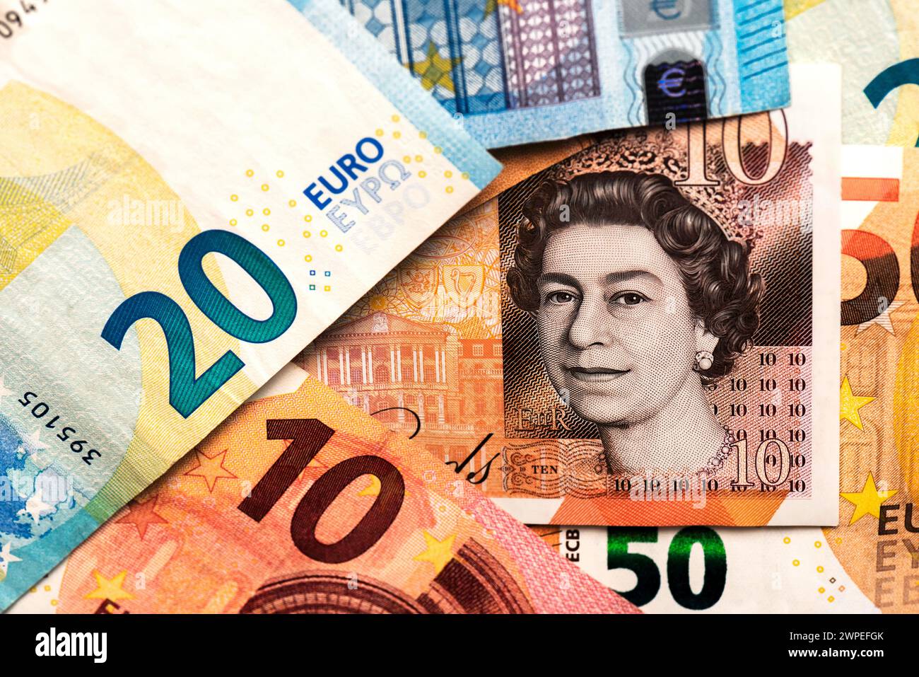 Closeup of British Pound money bill of United Kingdom and euro bills. Trading Euro with British ...