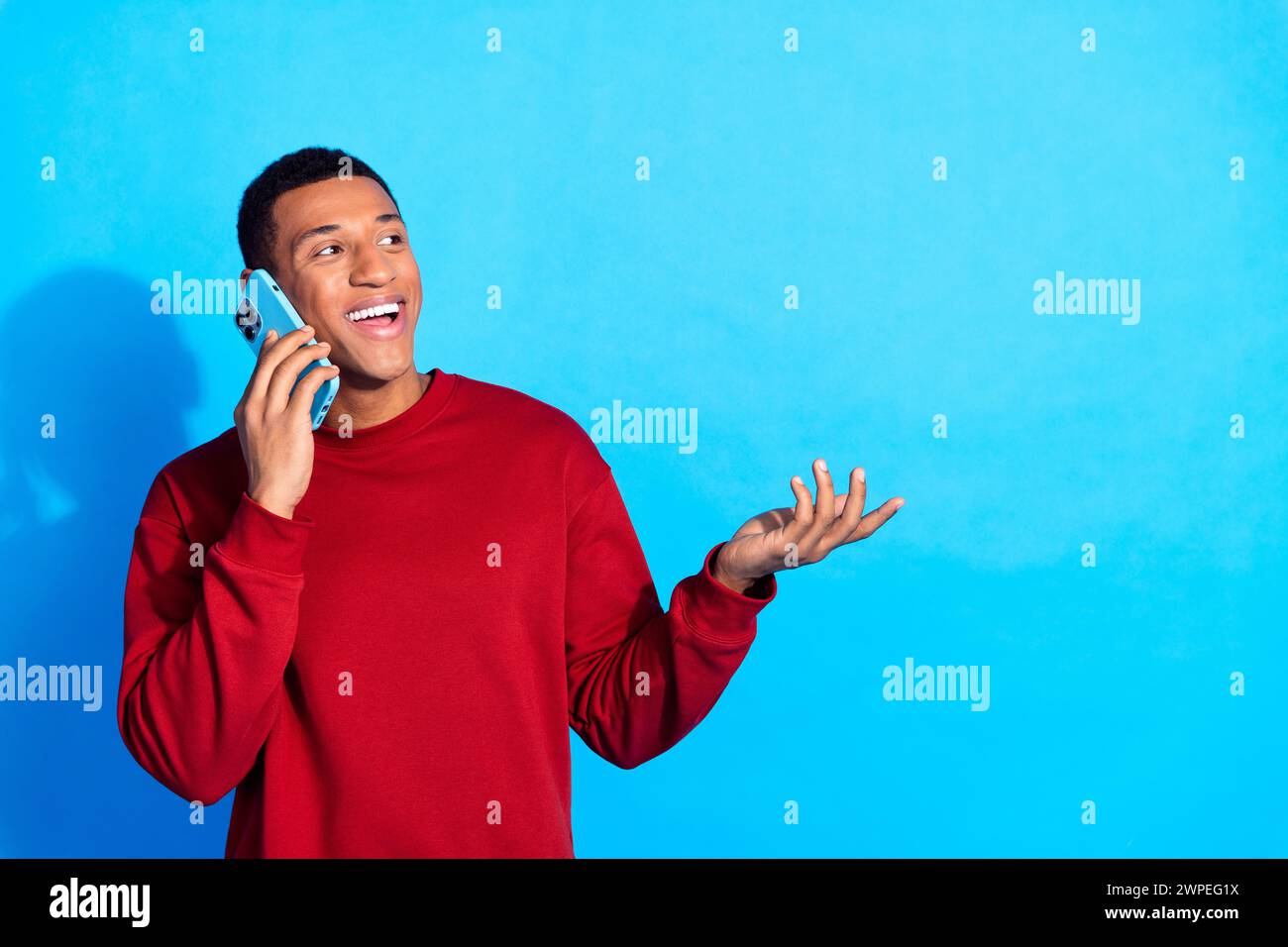 Photo of positive guy have good mood speak telephone empty space ...