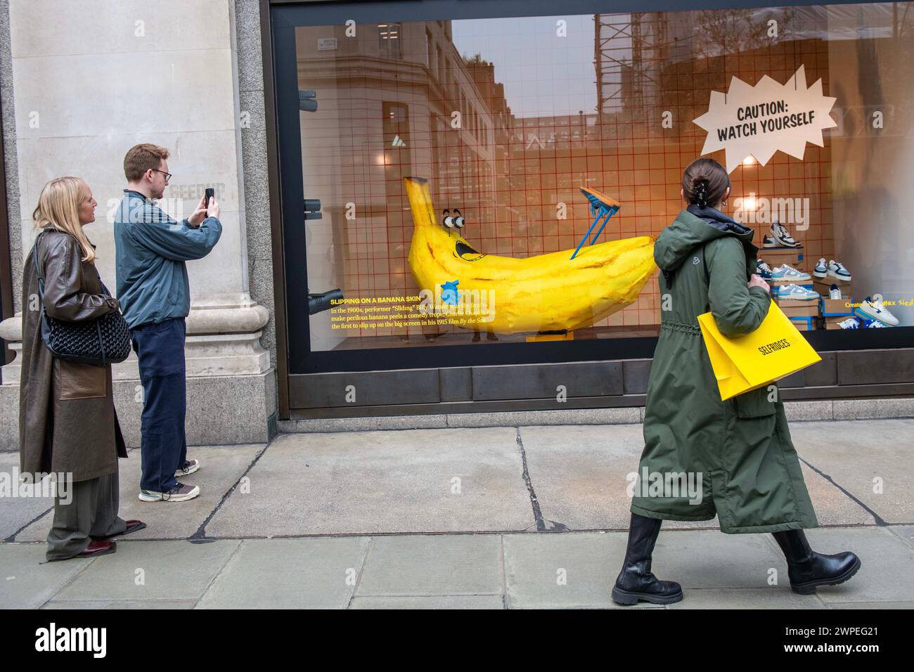 EDITORIAL USE ONLY Customers enjoy window displays at Selfridges London ...