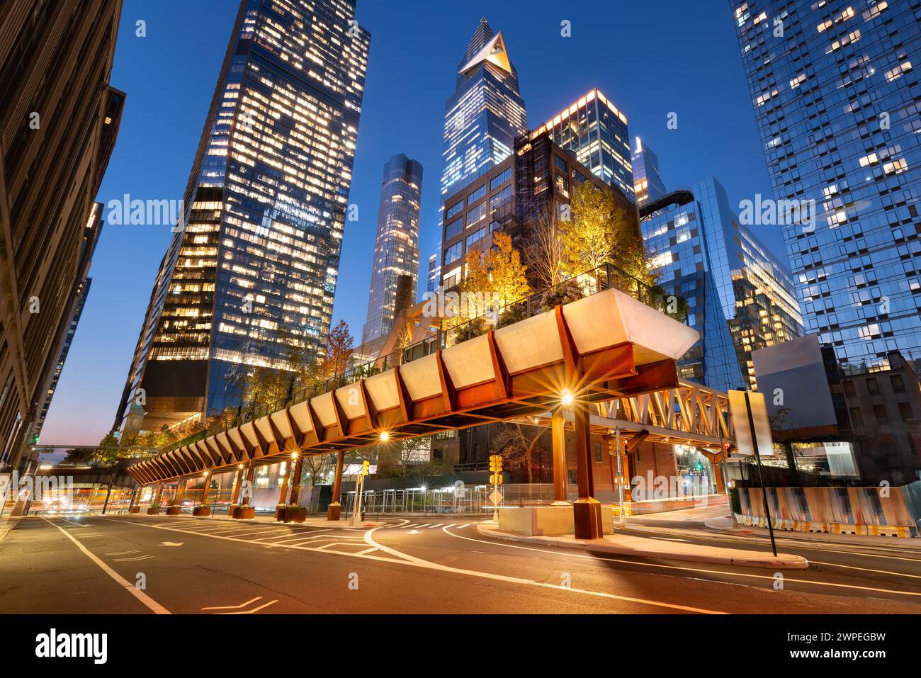New York City High Line Park bridge extension on 30th Street in evening ...