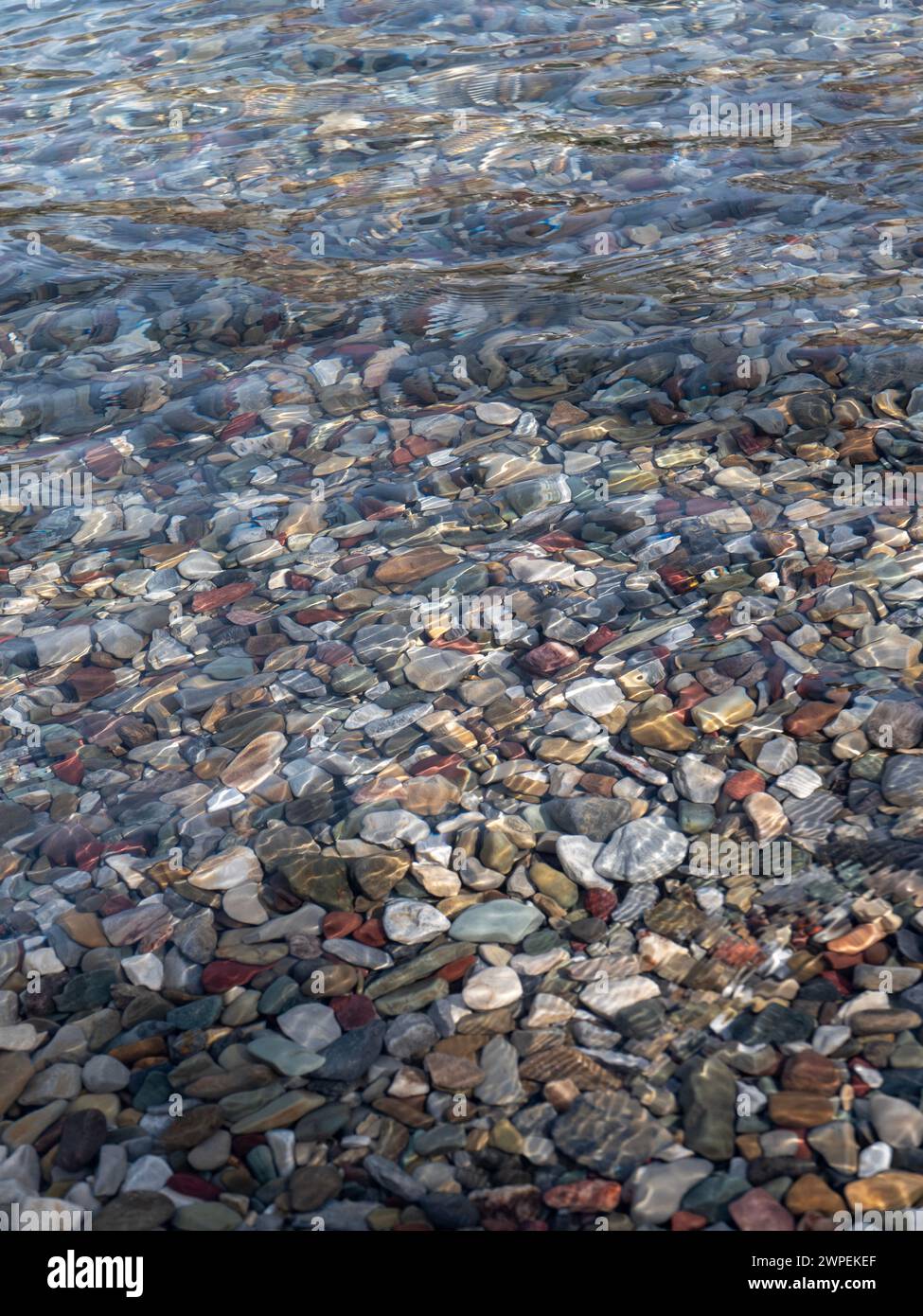Pebbles on the bottom of a clear glacial lake, Waterton, Alberta ...