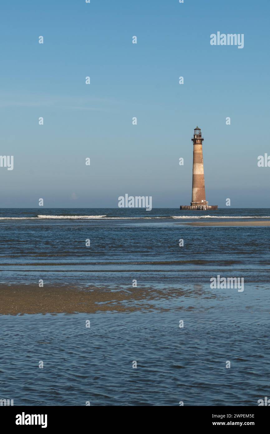 Morris Island Lighthouse from the shoreline of Folly Beach near ...