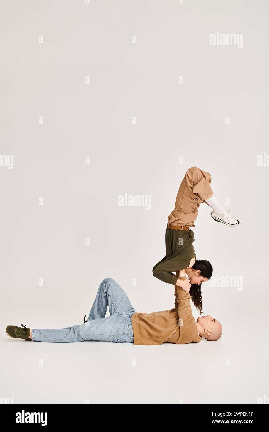 Strong acrobatic woman hi-res stock photography and images - Alamy