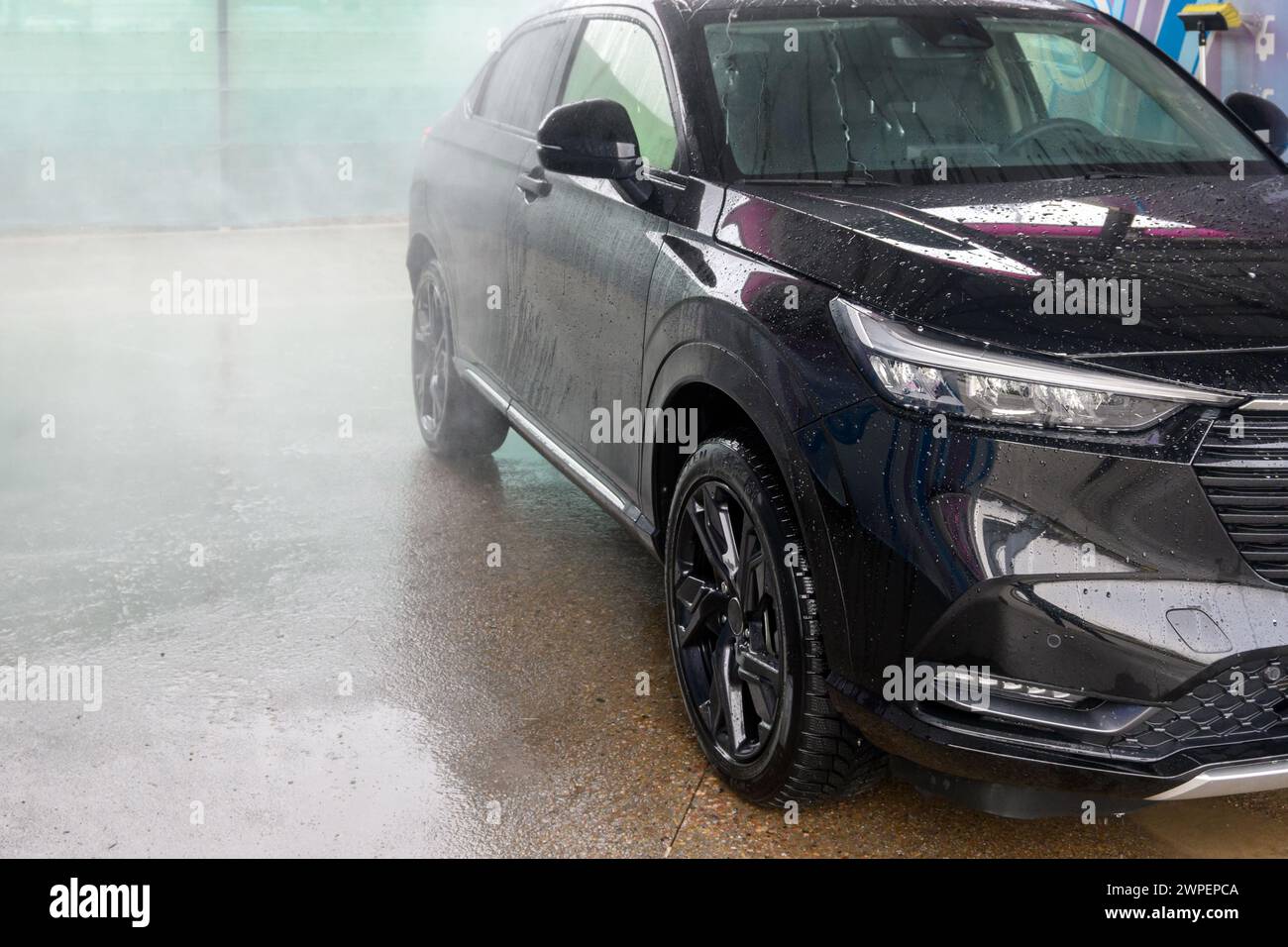 Manual car wash with pressurized water in car wash outside Stock Photo ...