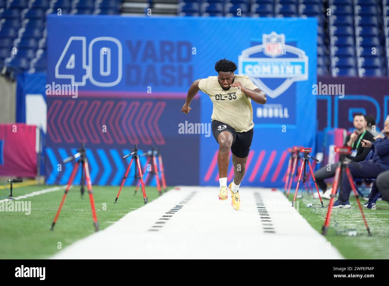Connecticut offensive lineman Christian Haynes runs the 40-yard dash at ...