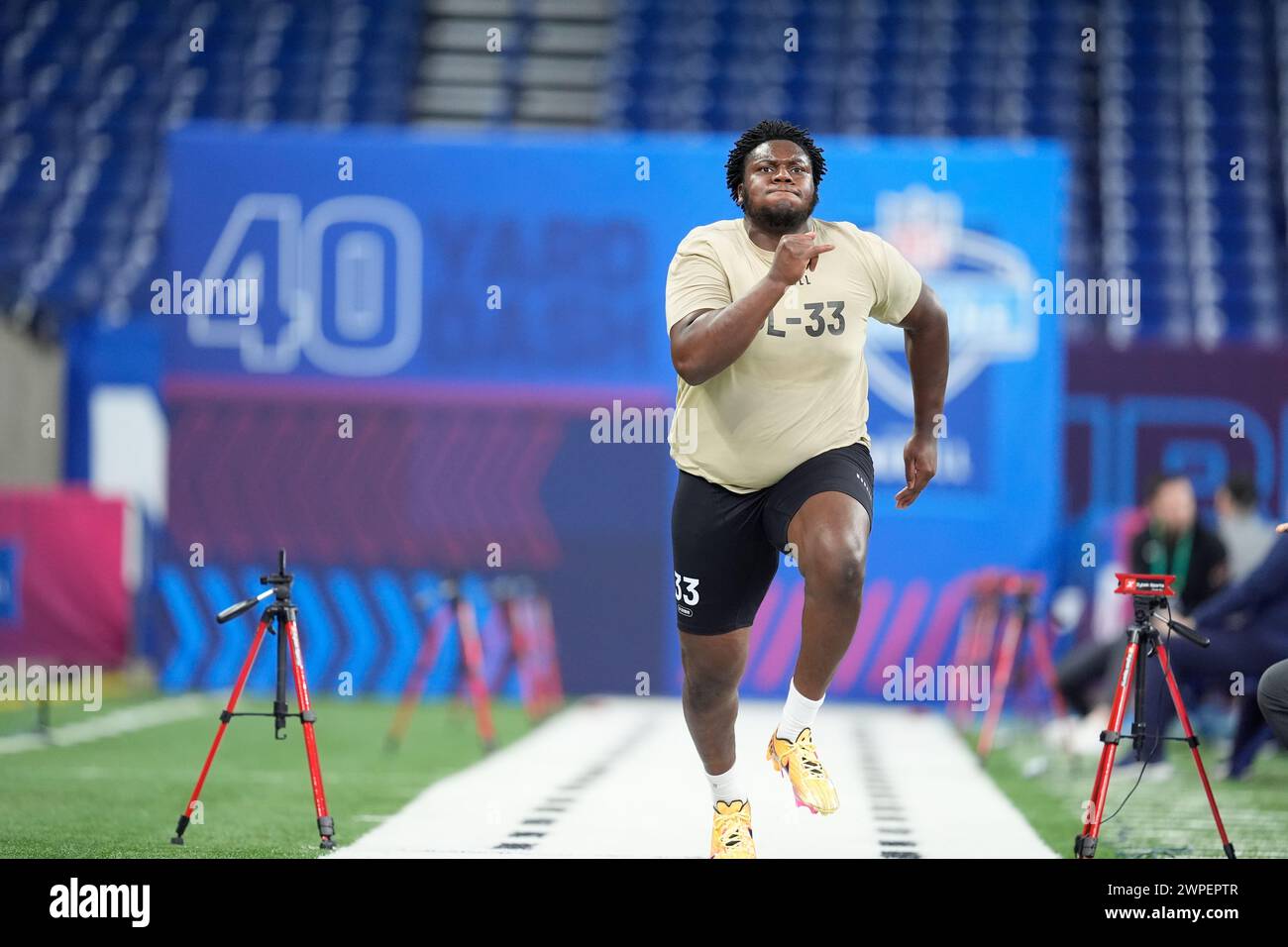Connecticut offensive lineman Christian Haynes runs the 40-yard dash at ...