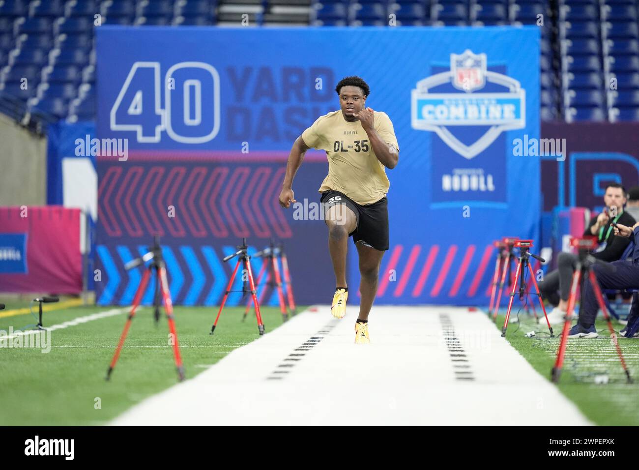 Texas offensive lineman Christian Jones runs the 40-yard dash at the ...