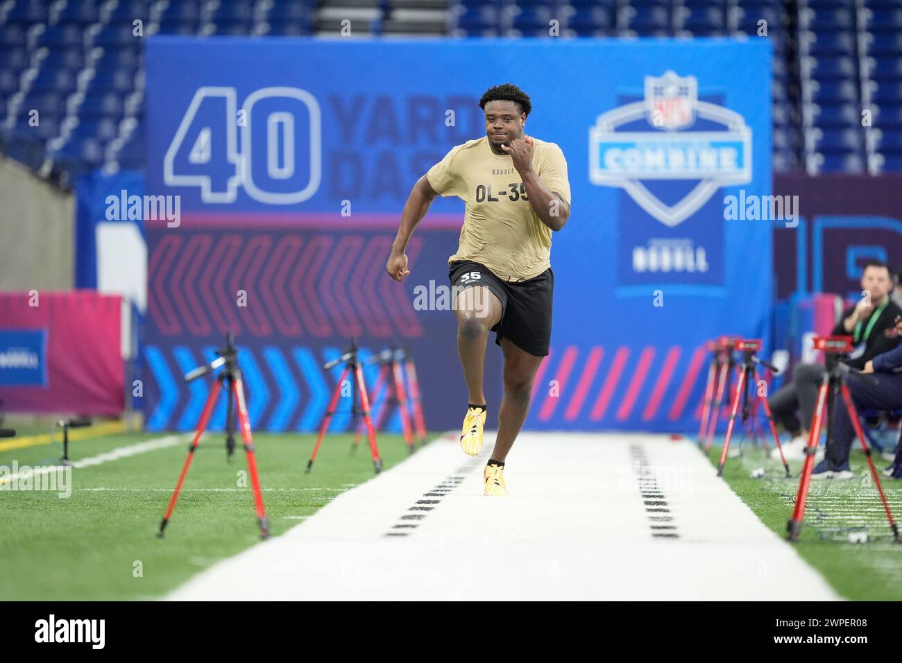 Texas offensive lineman Christian Jones runs the 40-yard dash at the ...