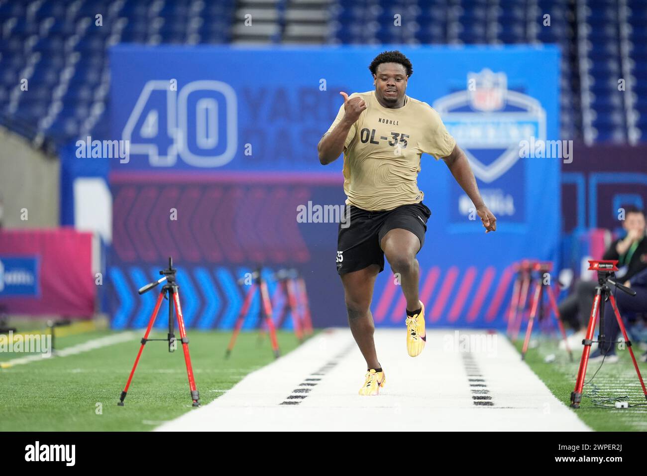 Texas offensive lineman Christian Jones runs the 40-yard dash at the ...