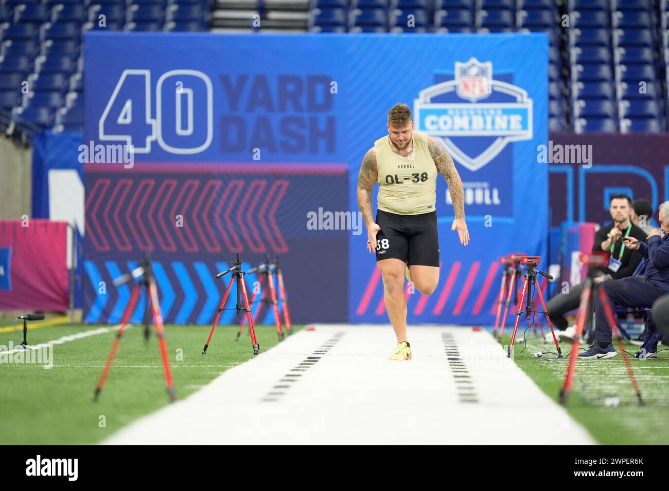 Michigan offensive lineman Trevor Keegan runs the 40-yard dash at the ...