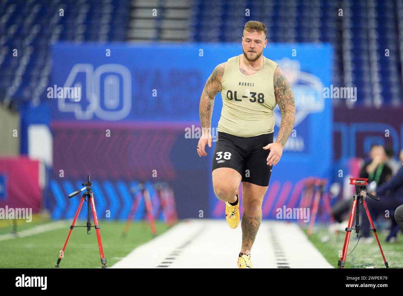 Michigan offensive lineman Trevor Keegan runs the 40-yard dash at the ...