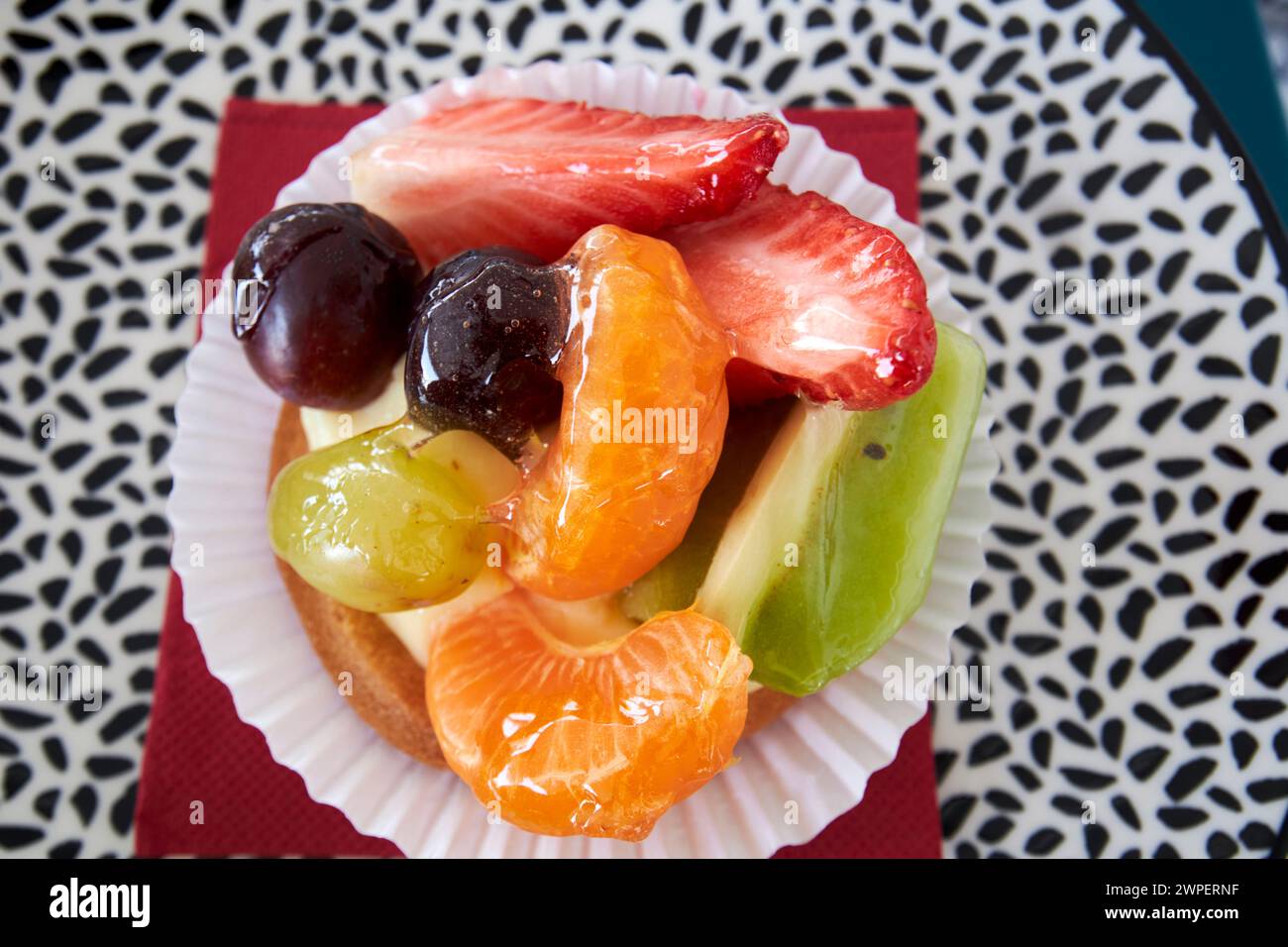 spanish glazed fruit custard tart cake tartoleta exotica in a cafe in ...