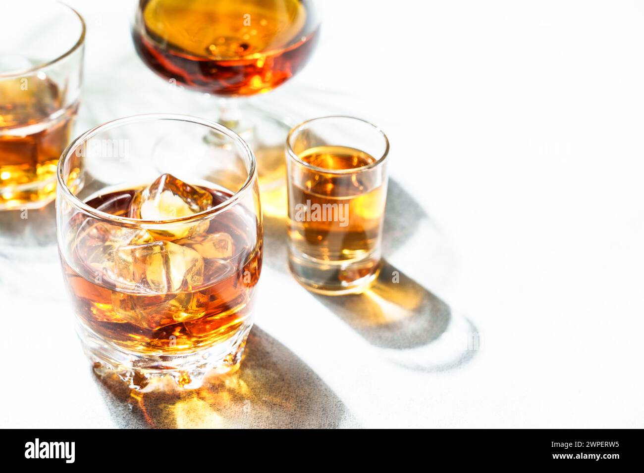 Strong alcohol drink. Whisky, rum, tequila, cognac at white background ...
