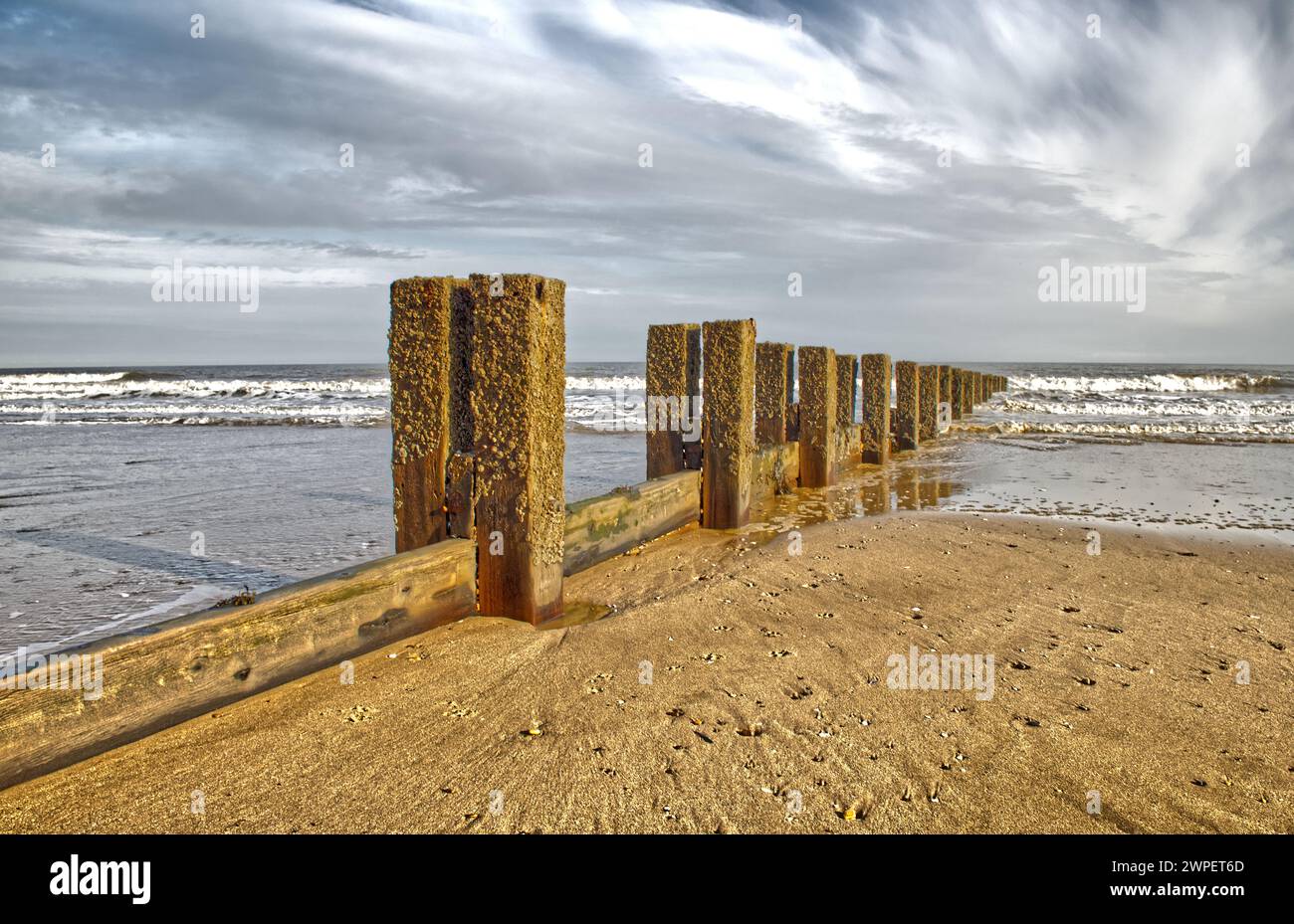 Groynes on the beach at Bridlington in Yorkshire protecting the ...