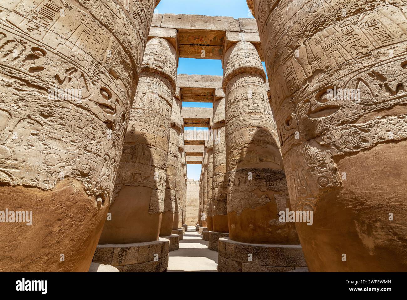 Rows of massive columns in Karnak temple in Luxor, Egypt Stock Photo ...