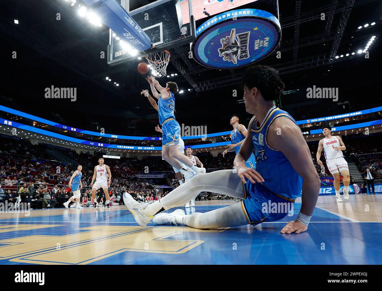 Beijing, China. 7th Mar, 2024. Ty Jacob Leaf (top) of Beijing Ducks ...