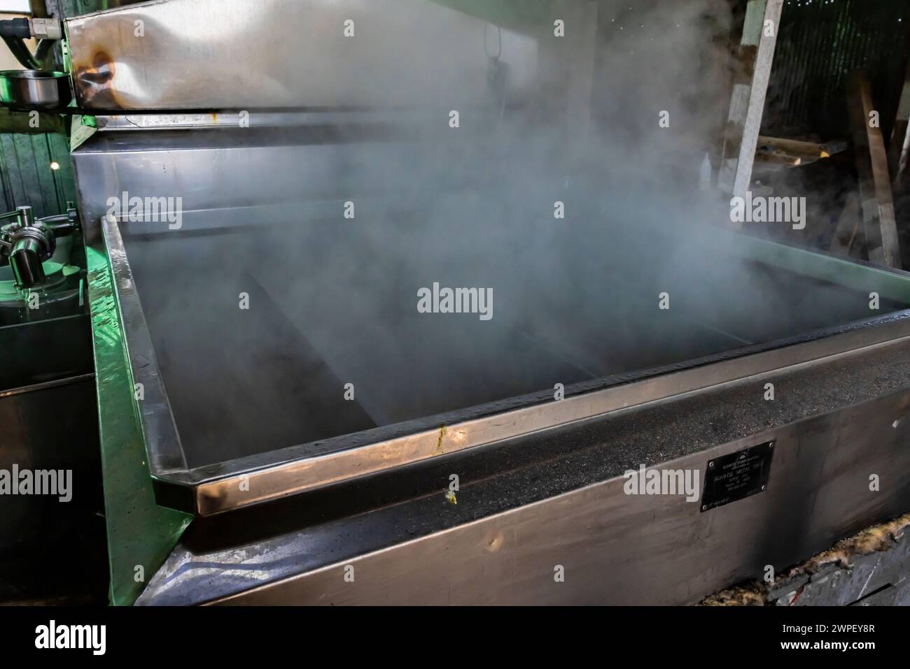 Evaporator in sugarhouse processing maple sap into syrup on an Amish ...