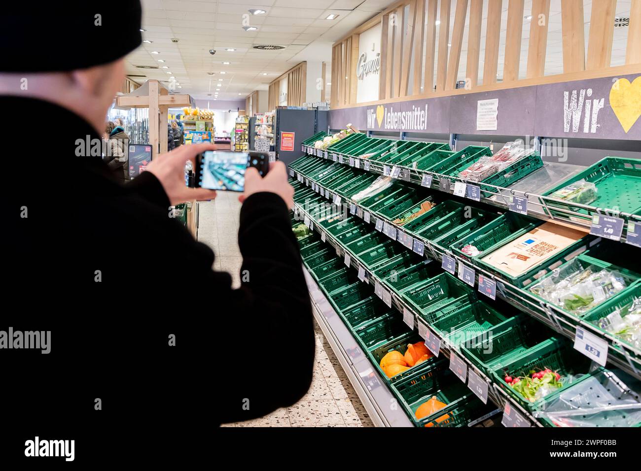 Berlin, Germany. 07th Mar, 2024. A customer in an Edeka supermarket in ...
