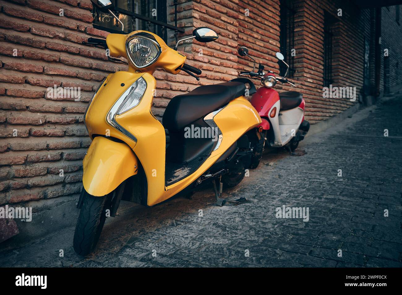 Two colorful scooters Stock Photo - Alamy
