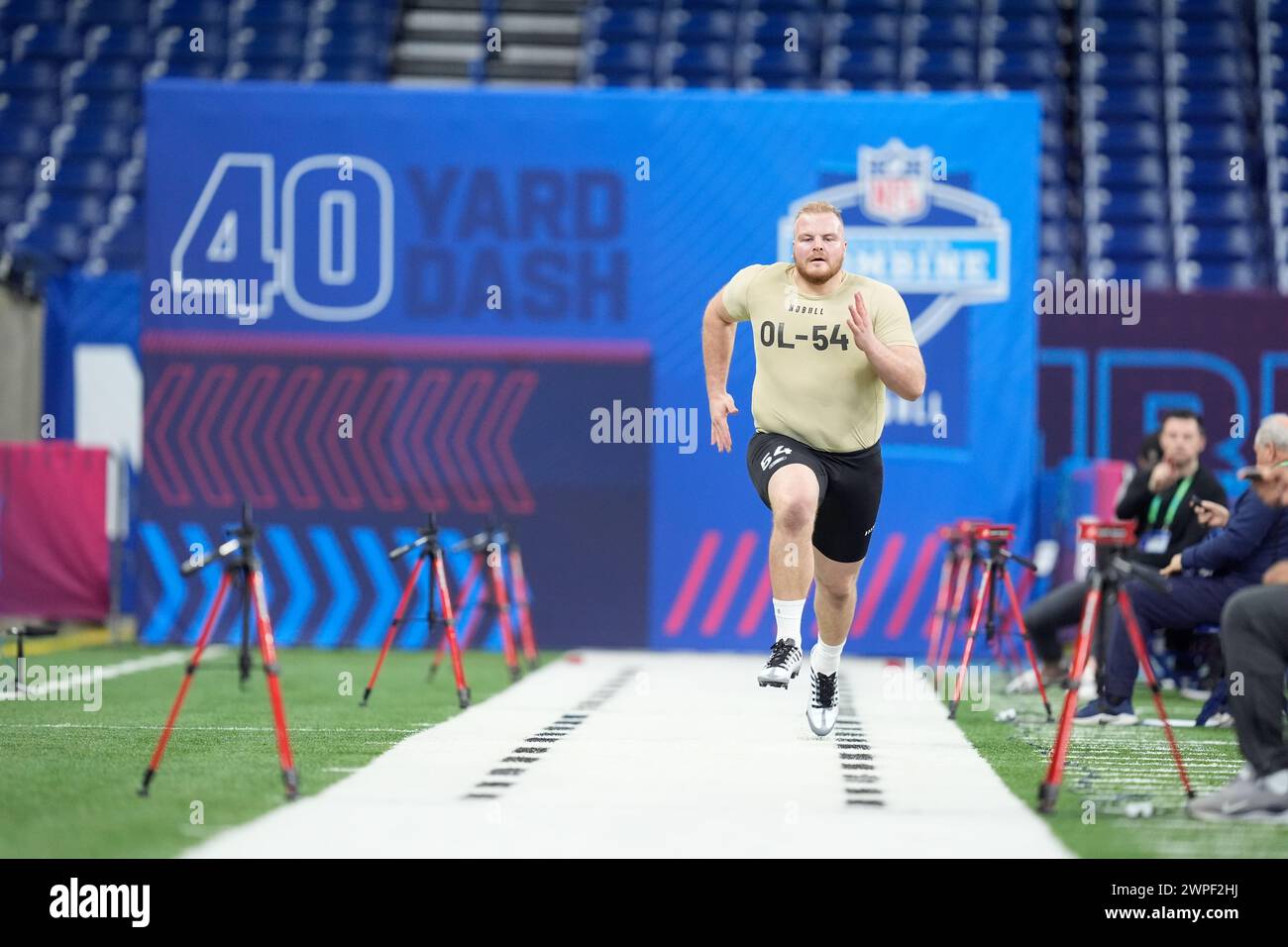Michigan offensive lineman Drake Nugent runs a drill at the NFL ...