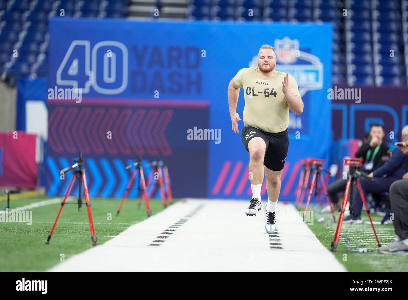 Michigan offensive lineman Drake Nugent runs a drill at the NFL ...