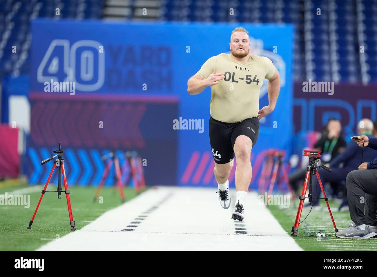 Michigan offensive lineman Drake Nugent runs a drill at the NFL ...