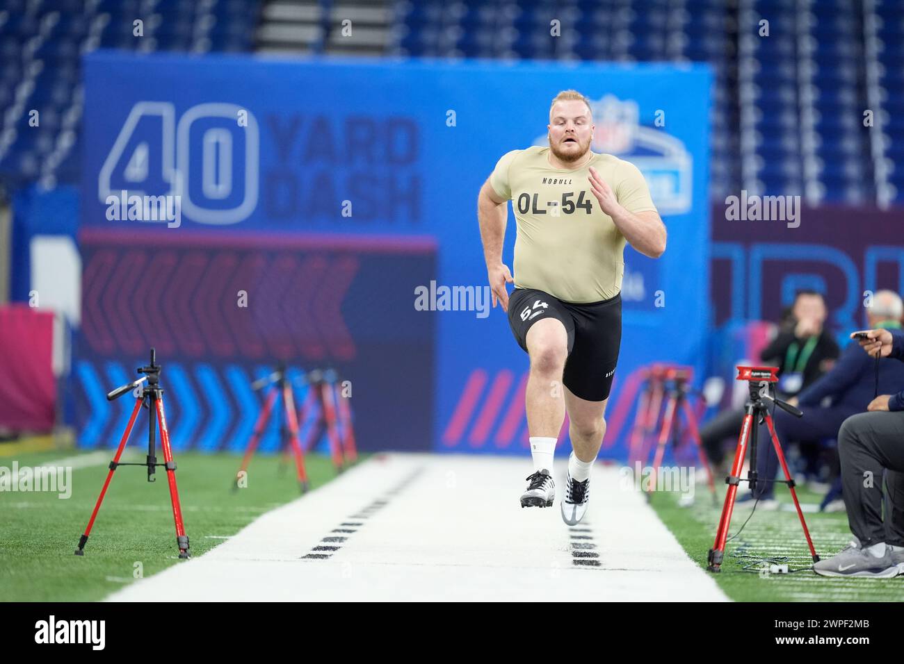 Michigan offensive lineman Drake Nugent runs a drill at the NFL ...