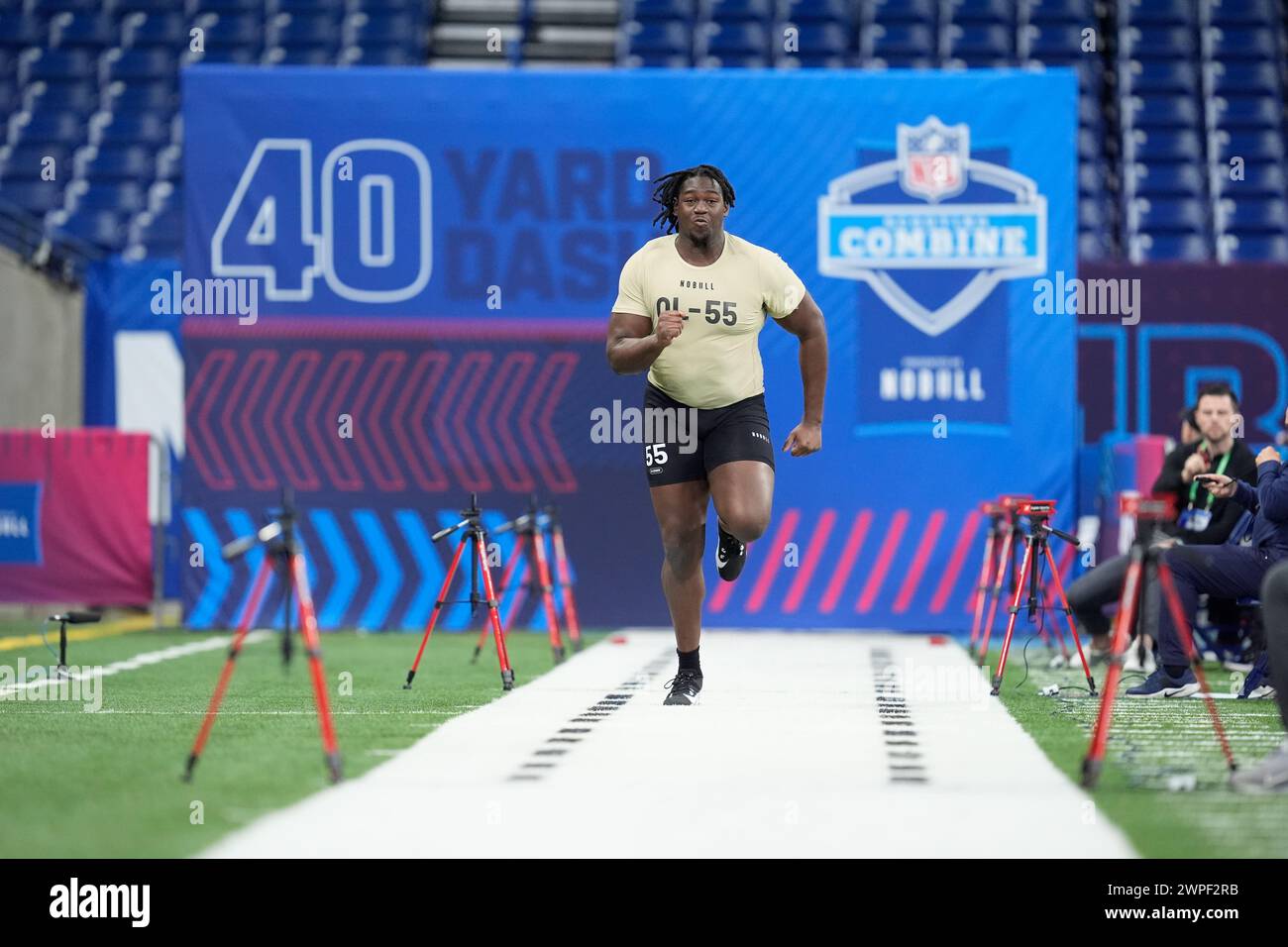 Houston offensive lineman Patrick Paul runs a drill at the NFL football scouting combine, Sunday ...