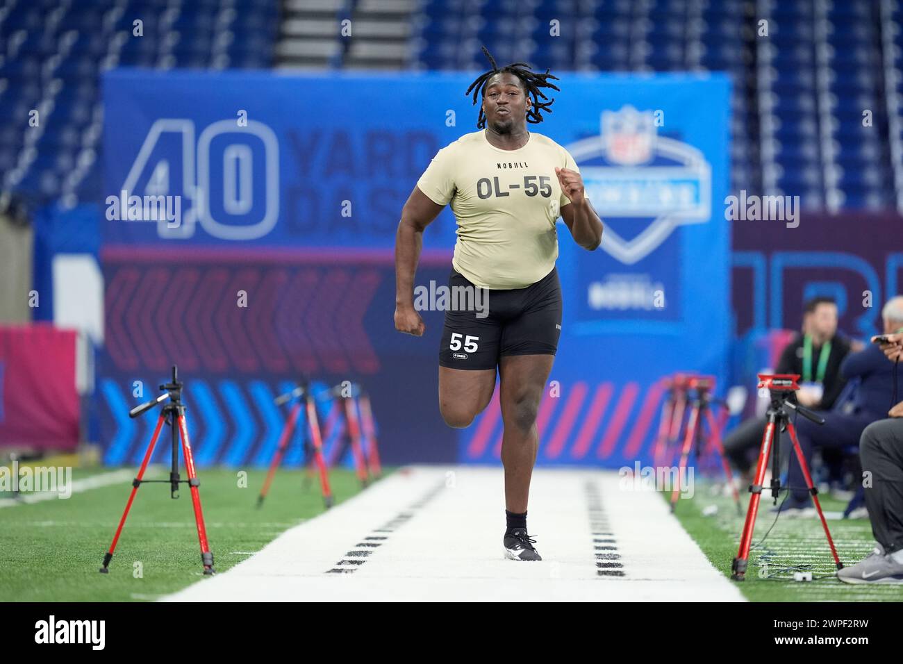 Houston offensive lineman Patrick Paul runs a drill at the NFL football scouting combine, Sunday ...