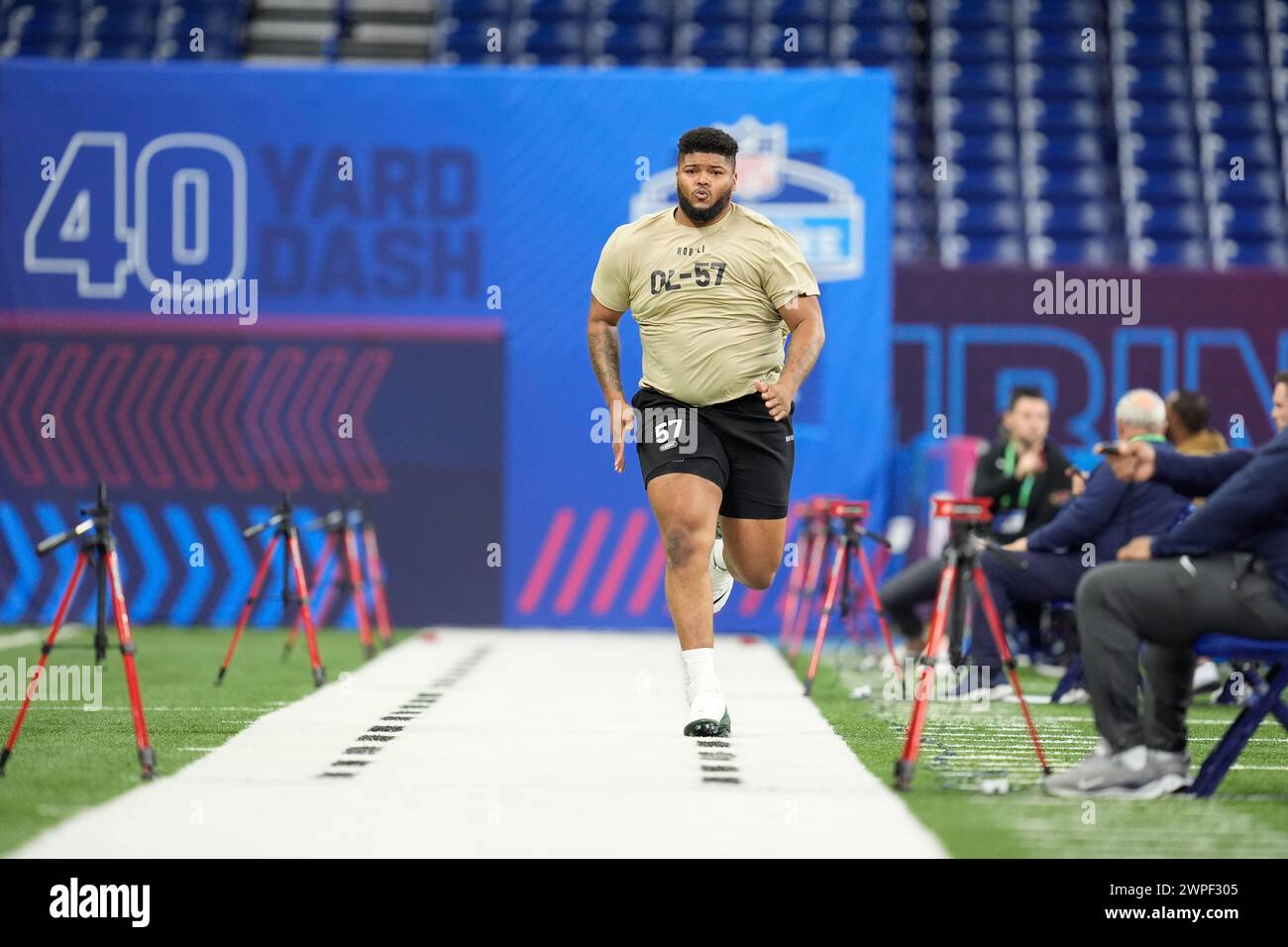 Tulane offensive lineman Prince Pines runs a drill at the NFL football scouting combine, Sunday ...