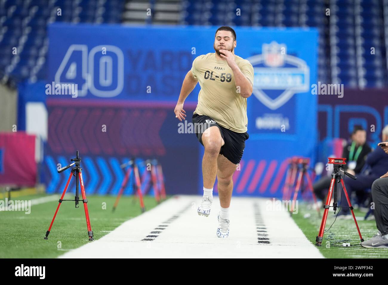 Kansas offensive lineman Dominick Puni runs a drill at the NFL football ...