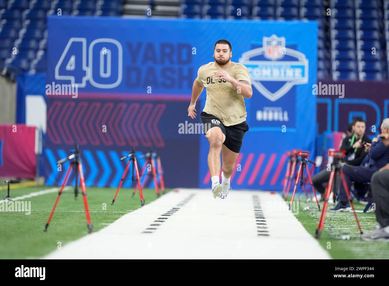 Kansas offensive lineman Dominick Puni runs a drill at the NFL football ...
