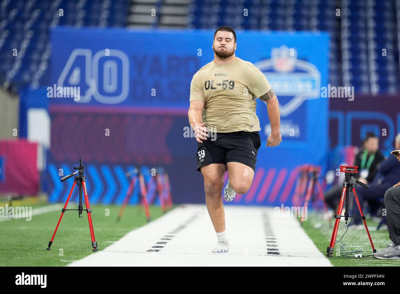 Kansas offensive lineman Dominick Puni runs a drill at the NFL football ...