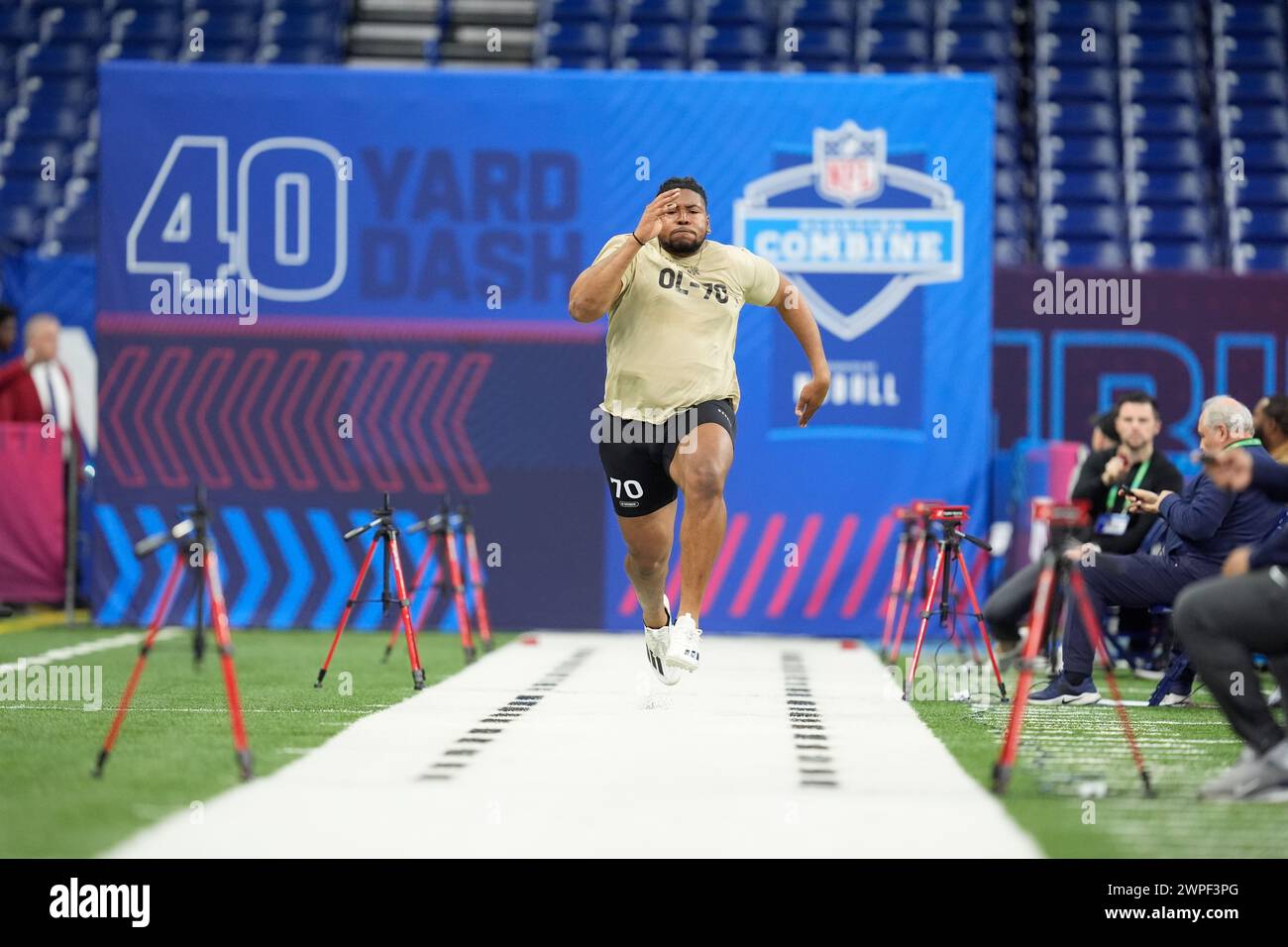 Penn State offensive lineman Caedan Wallace runs a drill at the NFL ...