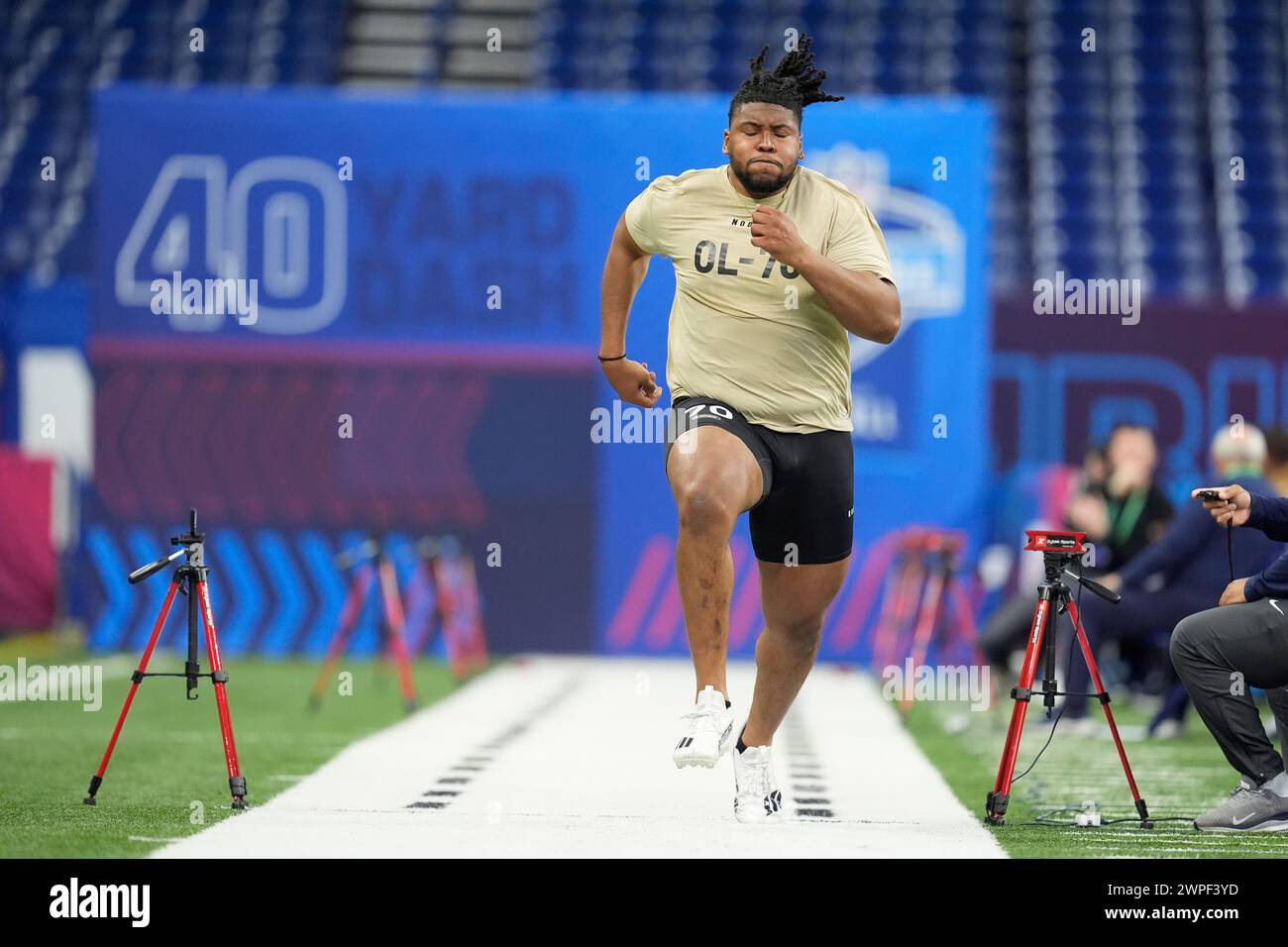 Penn State offensive lineman Caedan Wallace runs a drill at the NFL ...