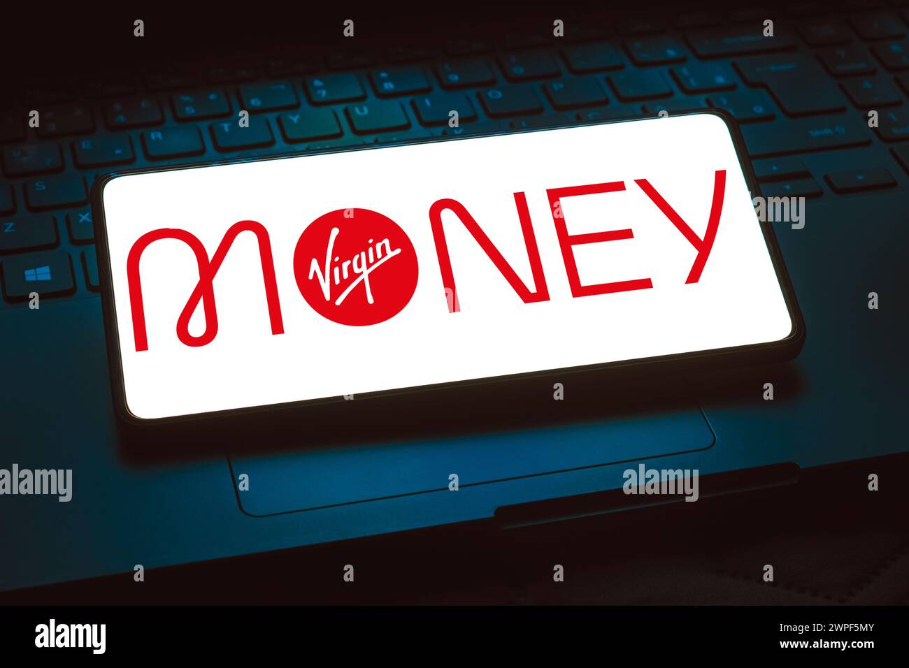 In this photo illustration, the Virgin Money UK logo is displayed on a ...